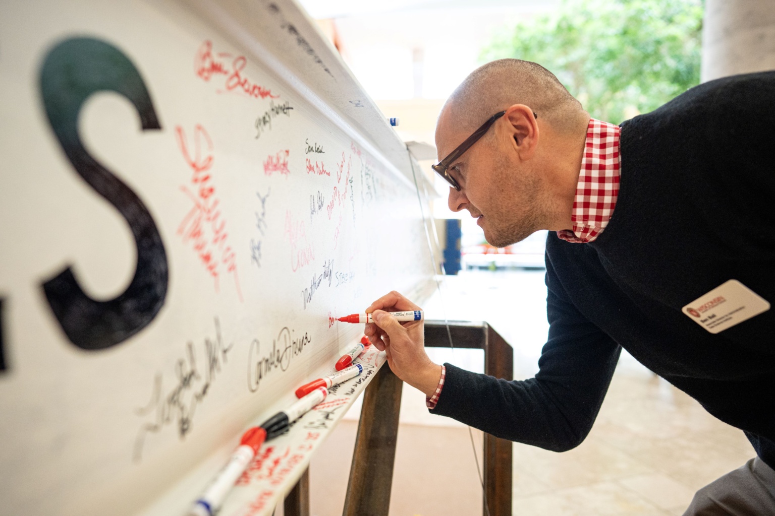 Beaming with pride: CDIS supporters make their mark on new building ...