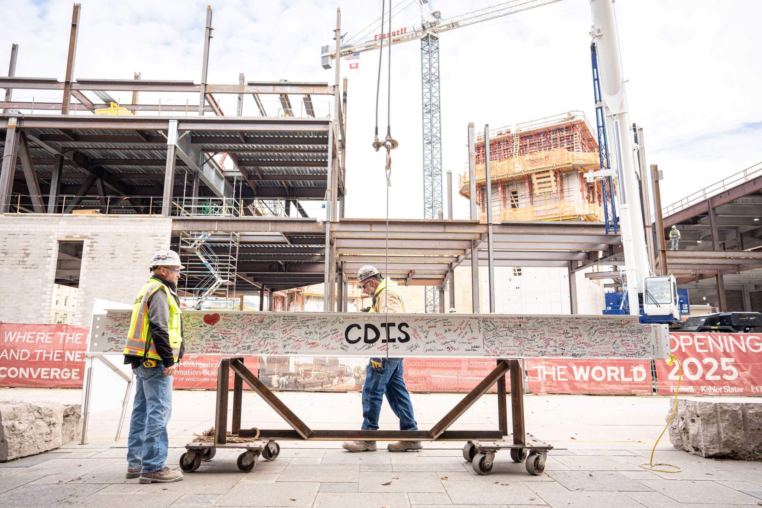Beaming with pride: CDIS supporters make their mark on new building ...