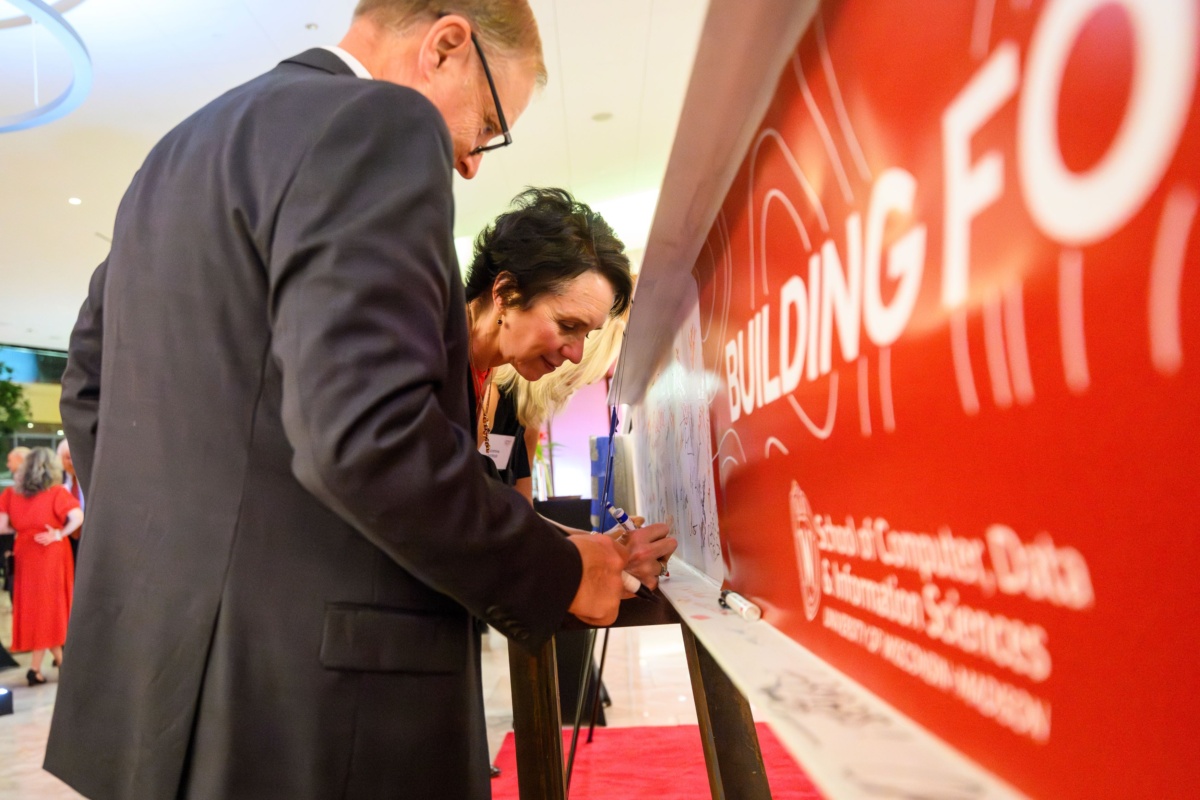 Beaming with pride: CDIS supporters make their mark on new building ...